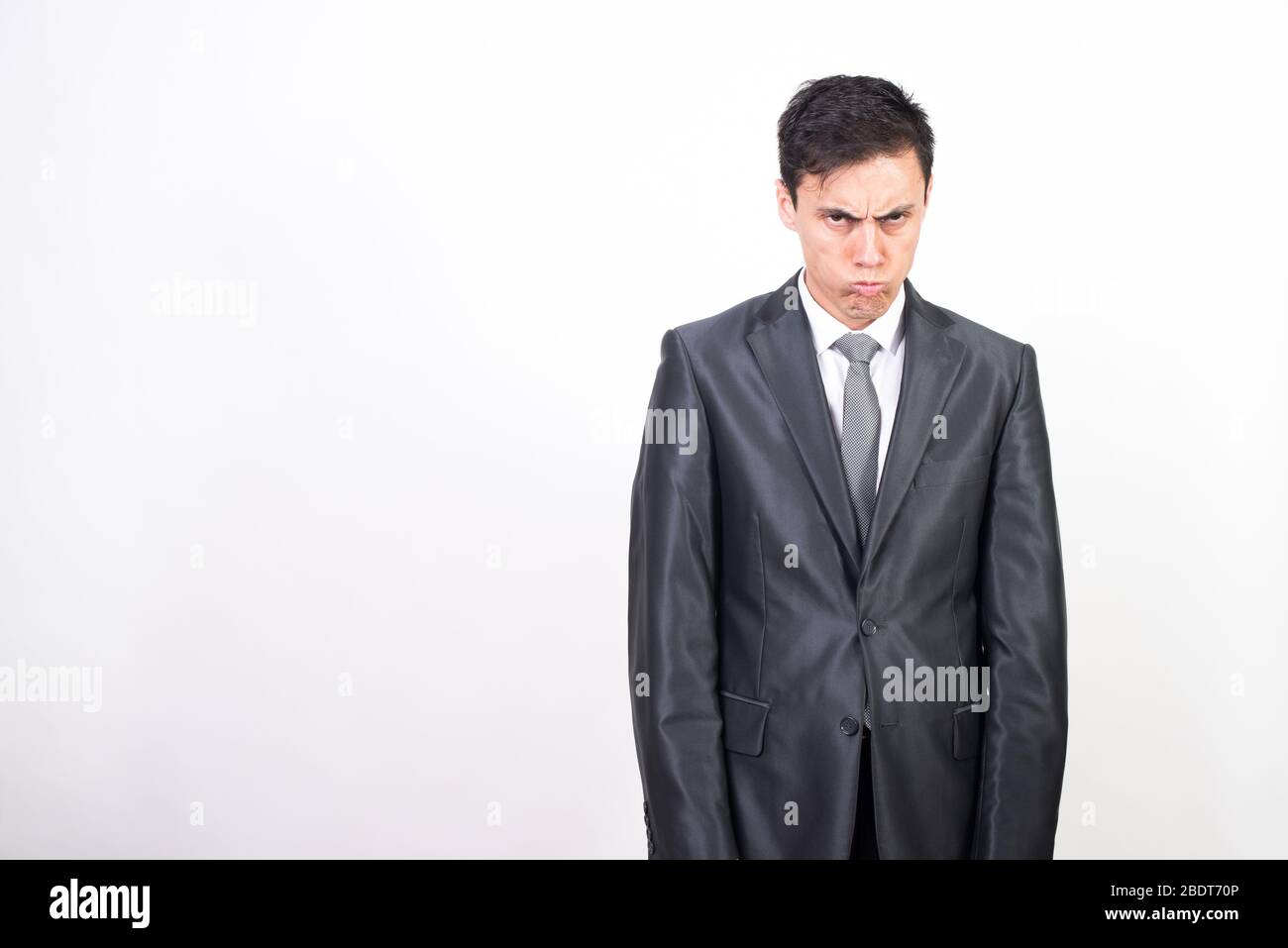 Angry man in suit. white background, medium shot Stock Photo - Alamy