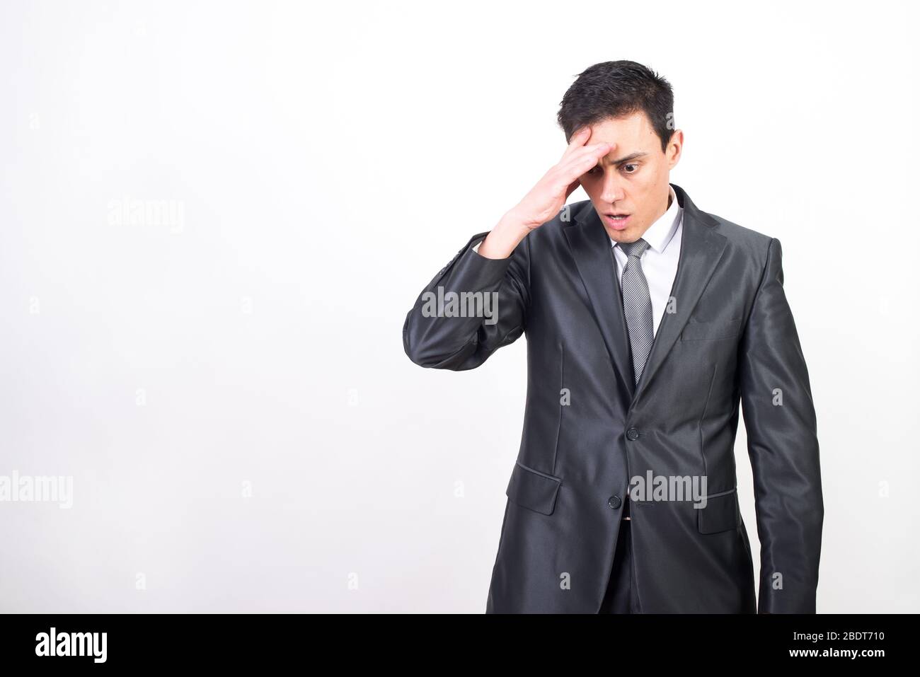 Man in suit who made a mistake. White background, medium shot Stock ...