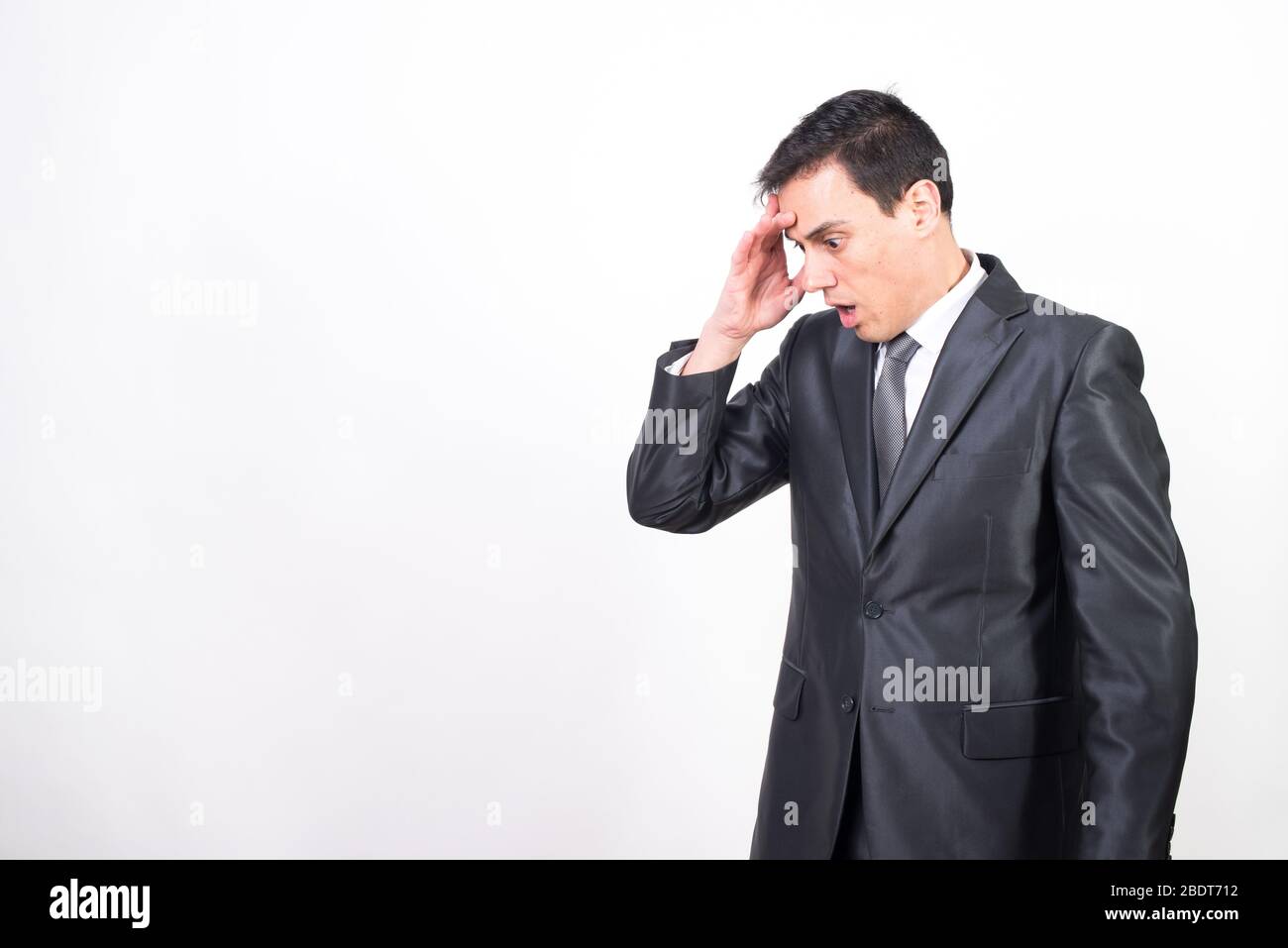 Man in suit who made a mistake. White background, medium shot Stock ...