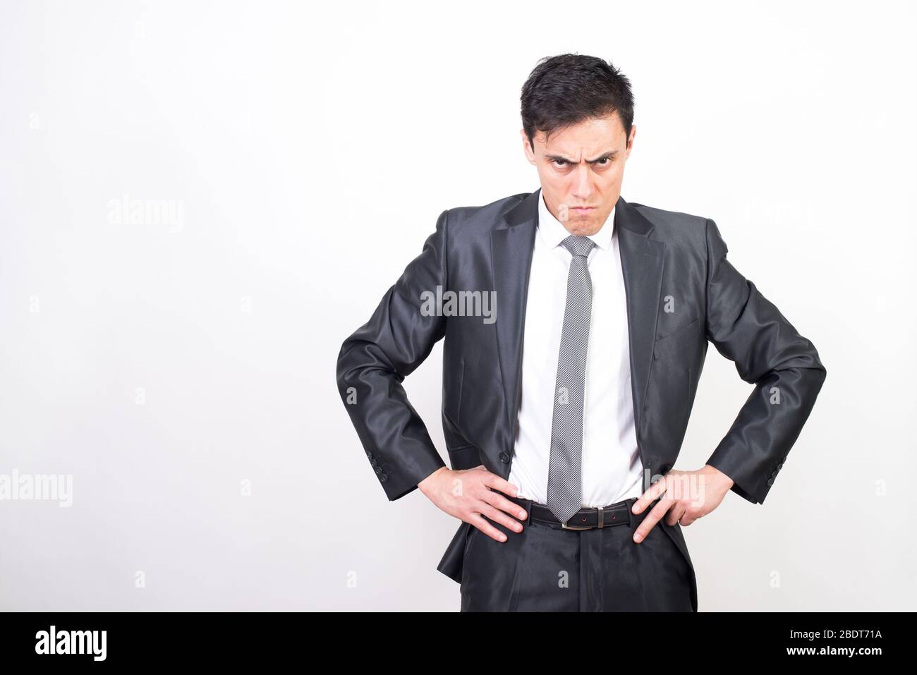 Angry man in suit. white background, medium shot Stock Photo - Alamy