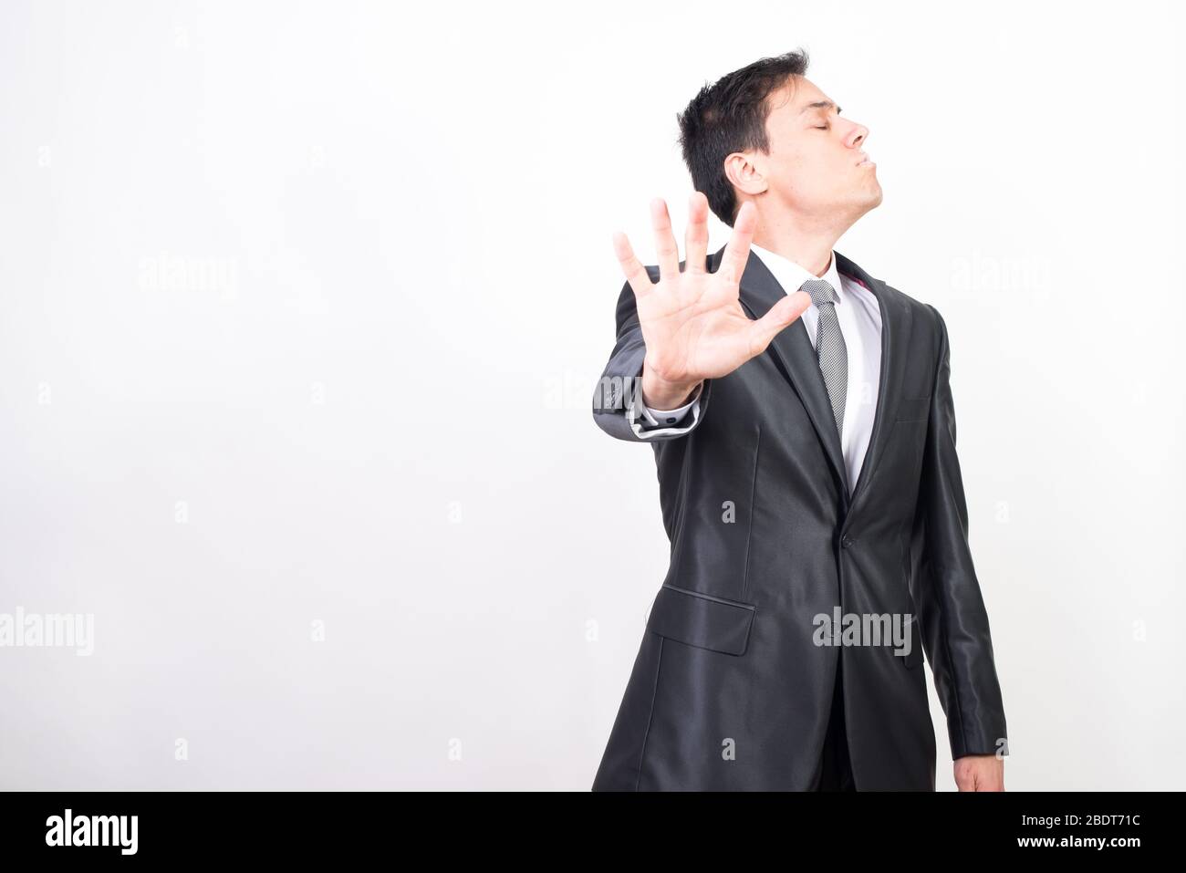 Angry man in suit. white background, medium shot Stock Photo - Alamy
