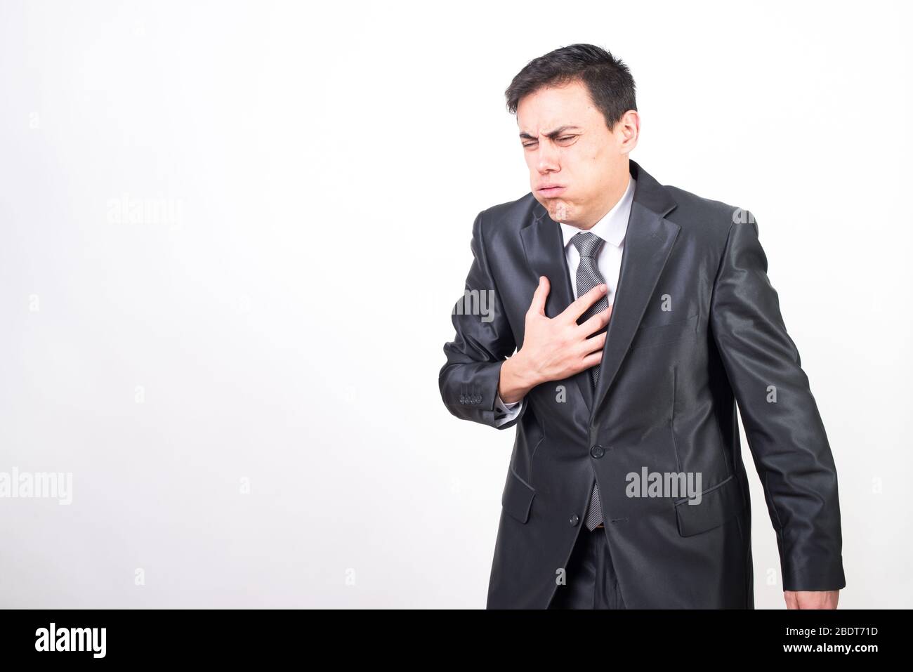 Sore man in suit. White background. middle plane Stock Photo - Alamy