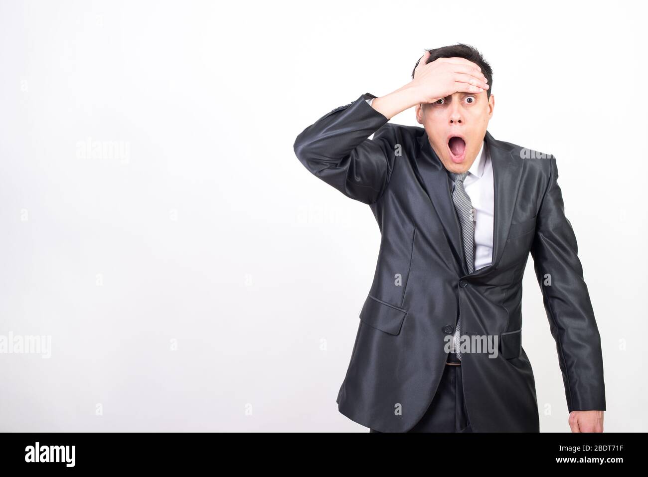 Man in suit who made a mistake. White background, medium shot Stock ...
