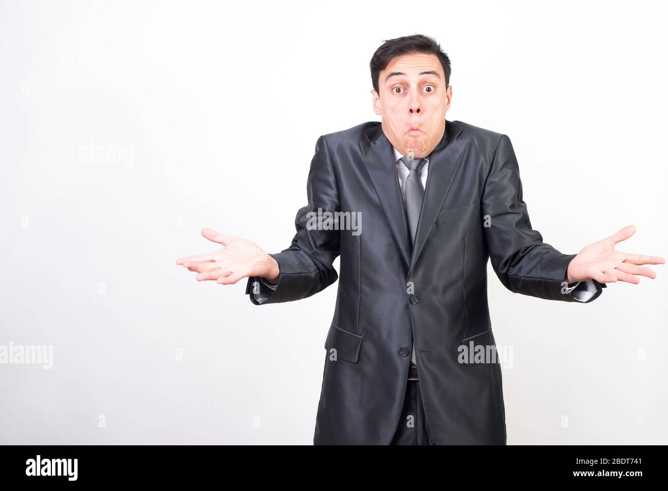 Doubting man in suit. White background, Medium shot Stock Photo - Alamy
