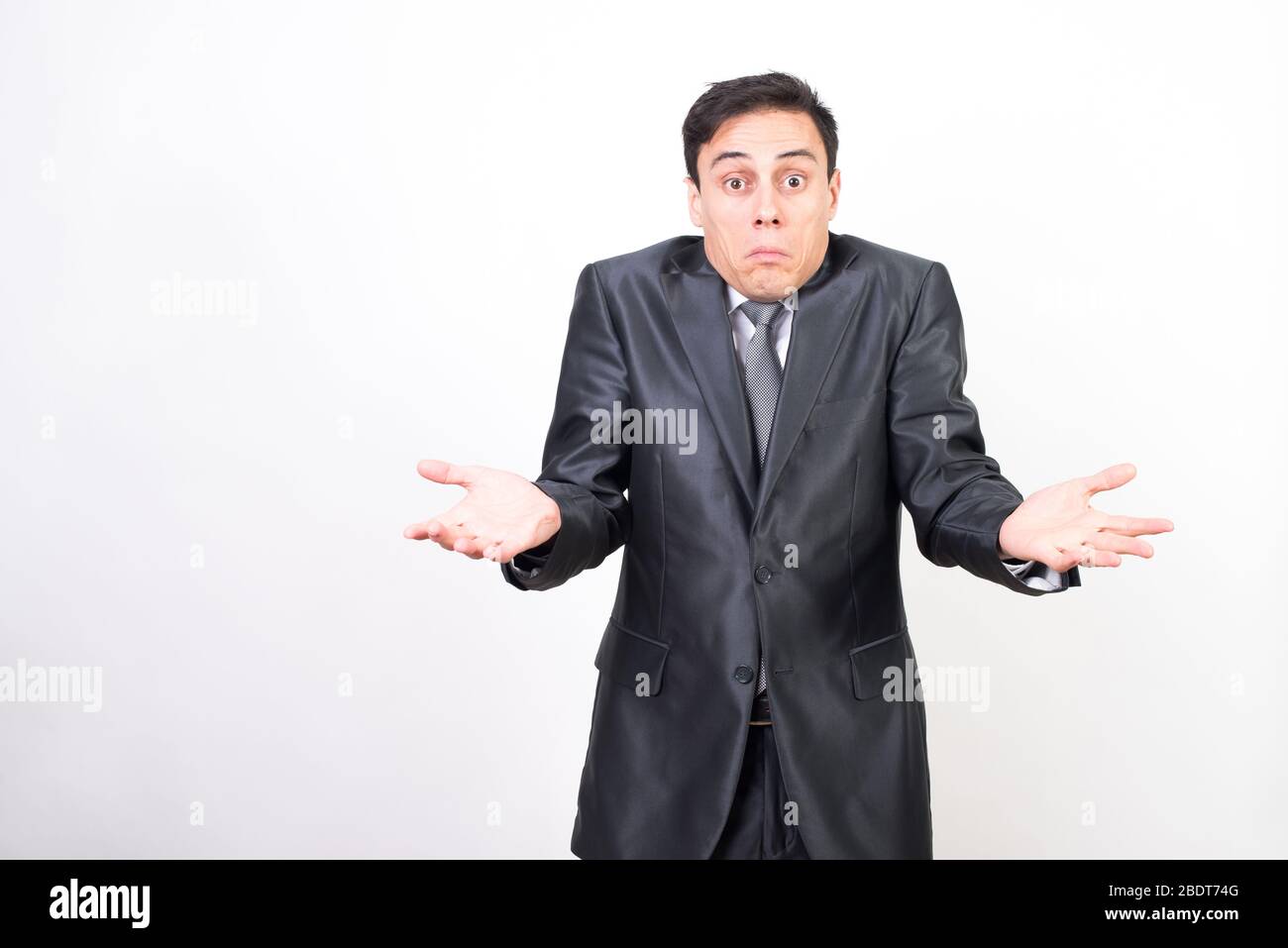 Doubting man in suit. White background, Medium shot Stock Photo - Alamy