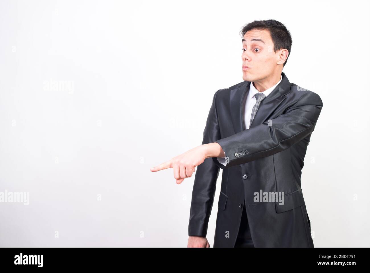 Man in suit scolding someone. White background, Medium shot Stock Photo ...