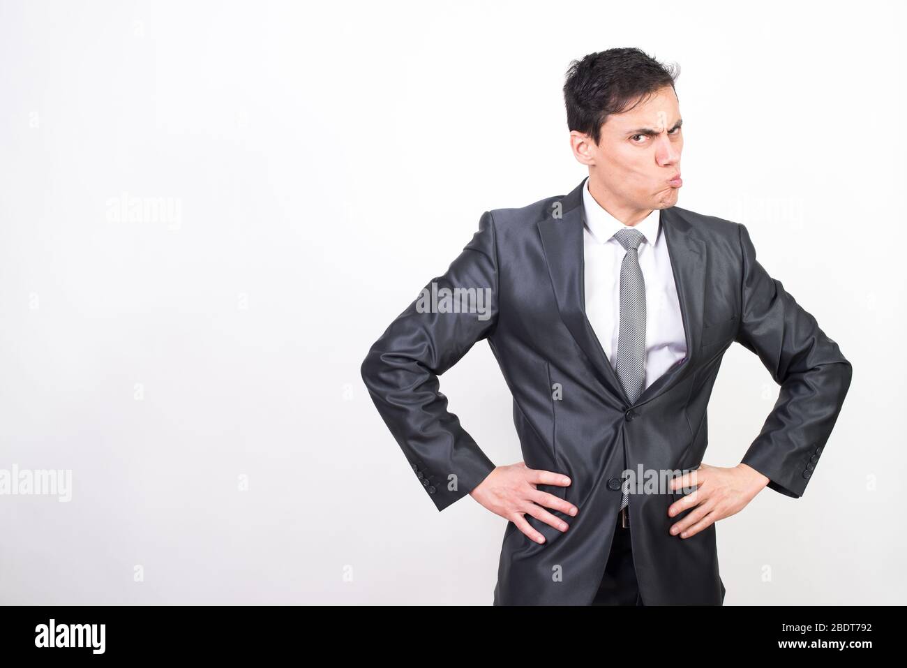 Man in suit scolding someone. White background, Medium shot Stock Photo ...