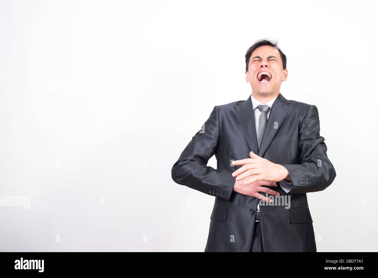 Laughing man in suit. White background, Medium shot Stock Photo - Alamy