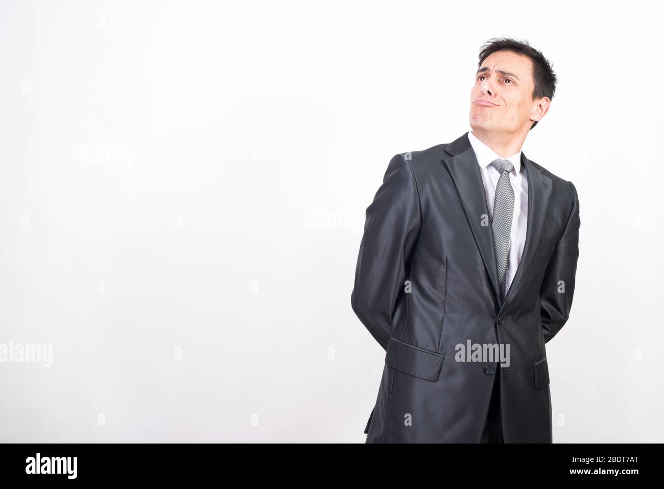 Arrogant man in suit. White background, Medium shot Stock Photo - Alamy