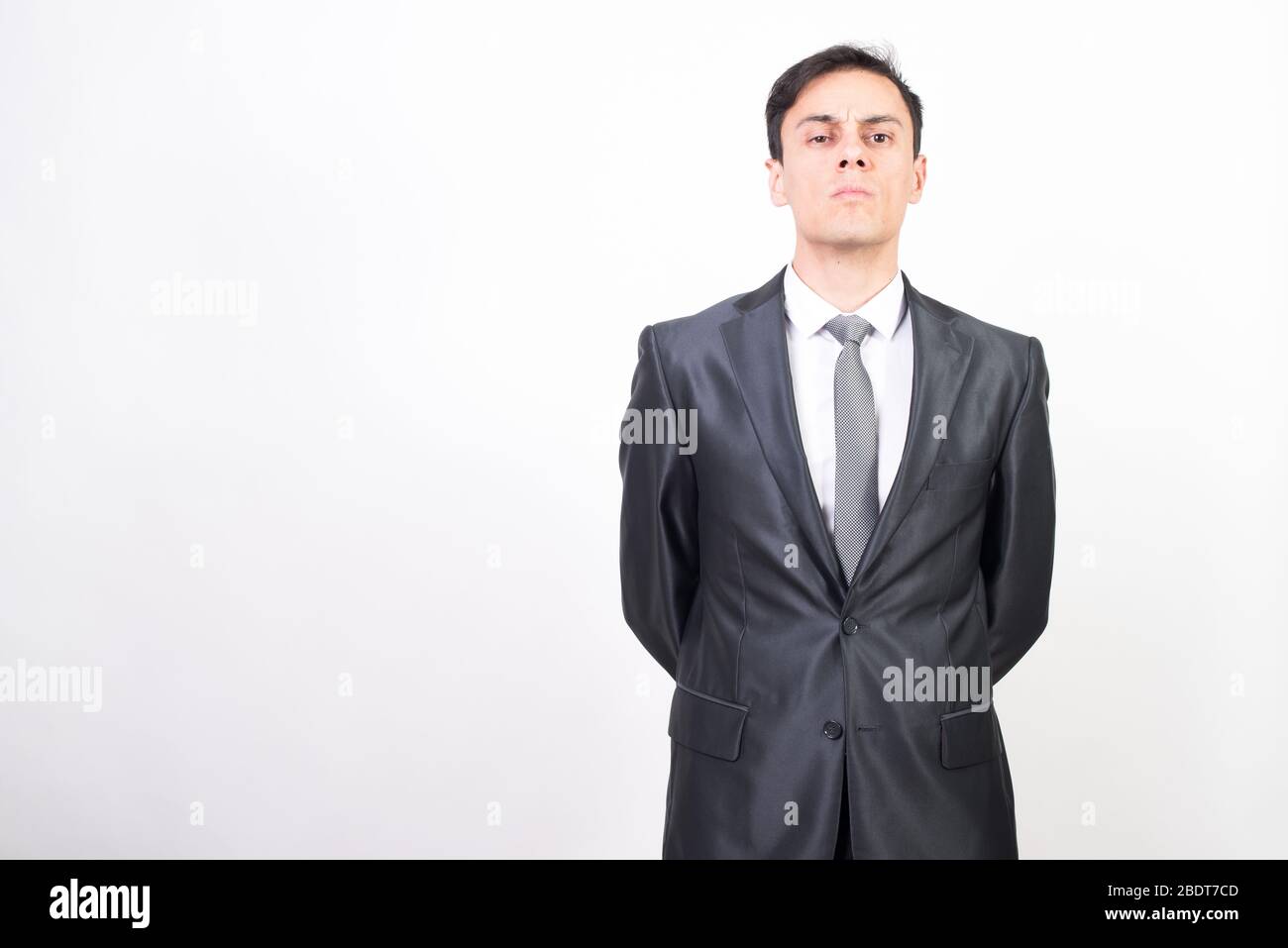 Serious man in suit. White background, Medium shot Stock Photo - Alamy