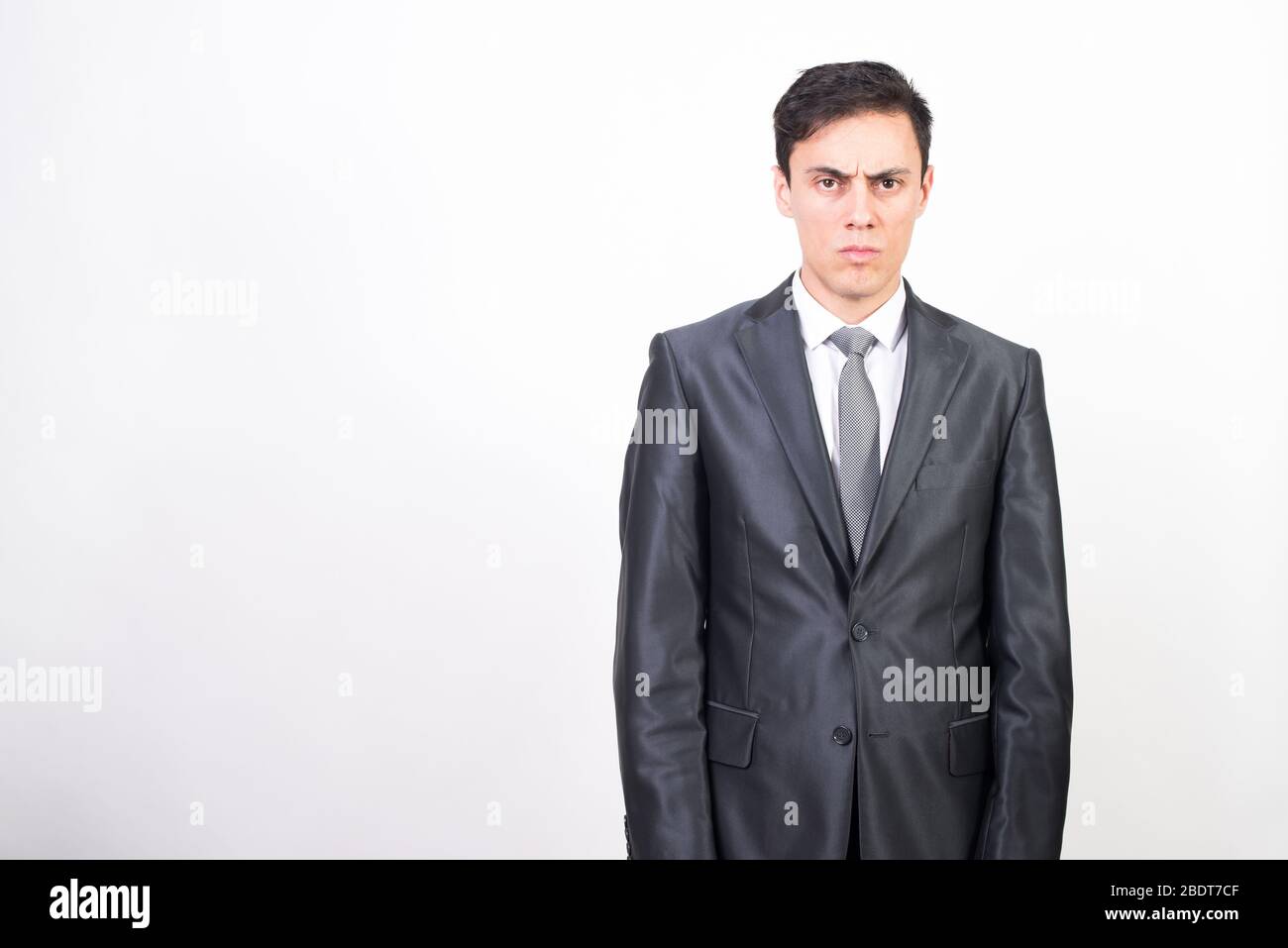 Serious man in suit. White background, Medium shot Stock Photo - Alamy