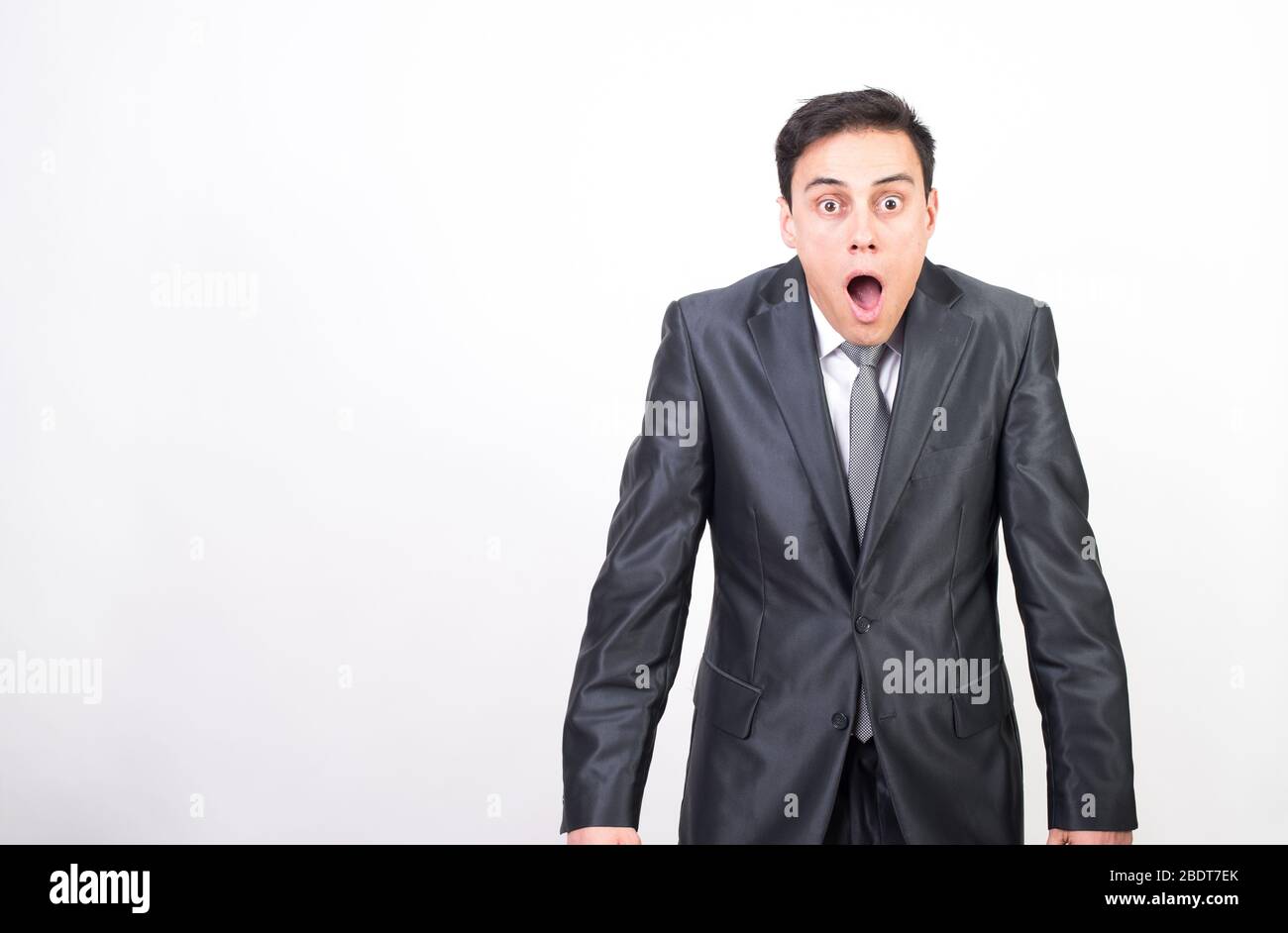 Surprised man in suit. White background, Medium shot Stock Photo - Alamy