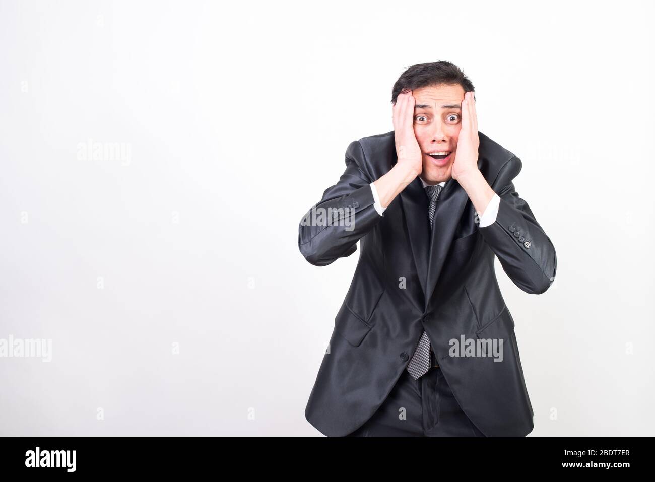 Surprised man in suit. White background, Medium shot Stock Photo - Alamy