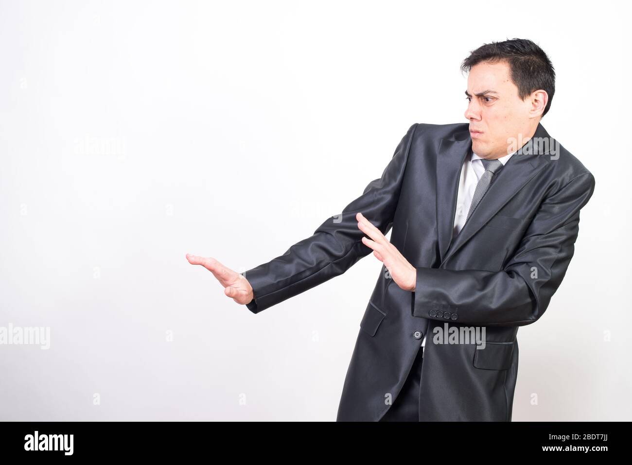 Scared man in suit on white background, medium shot Stock Photo - Alamy