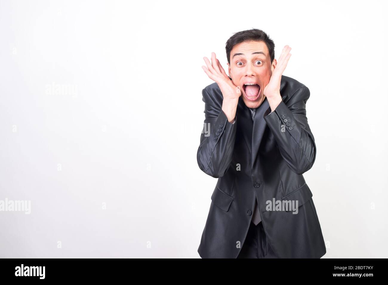 Surprised man in suit. White background, Medium shot Stock Photo - Alamy