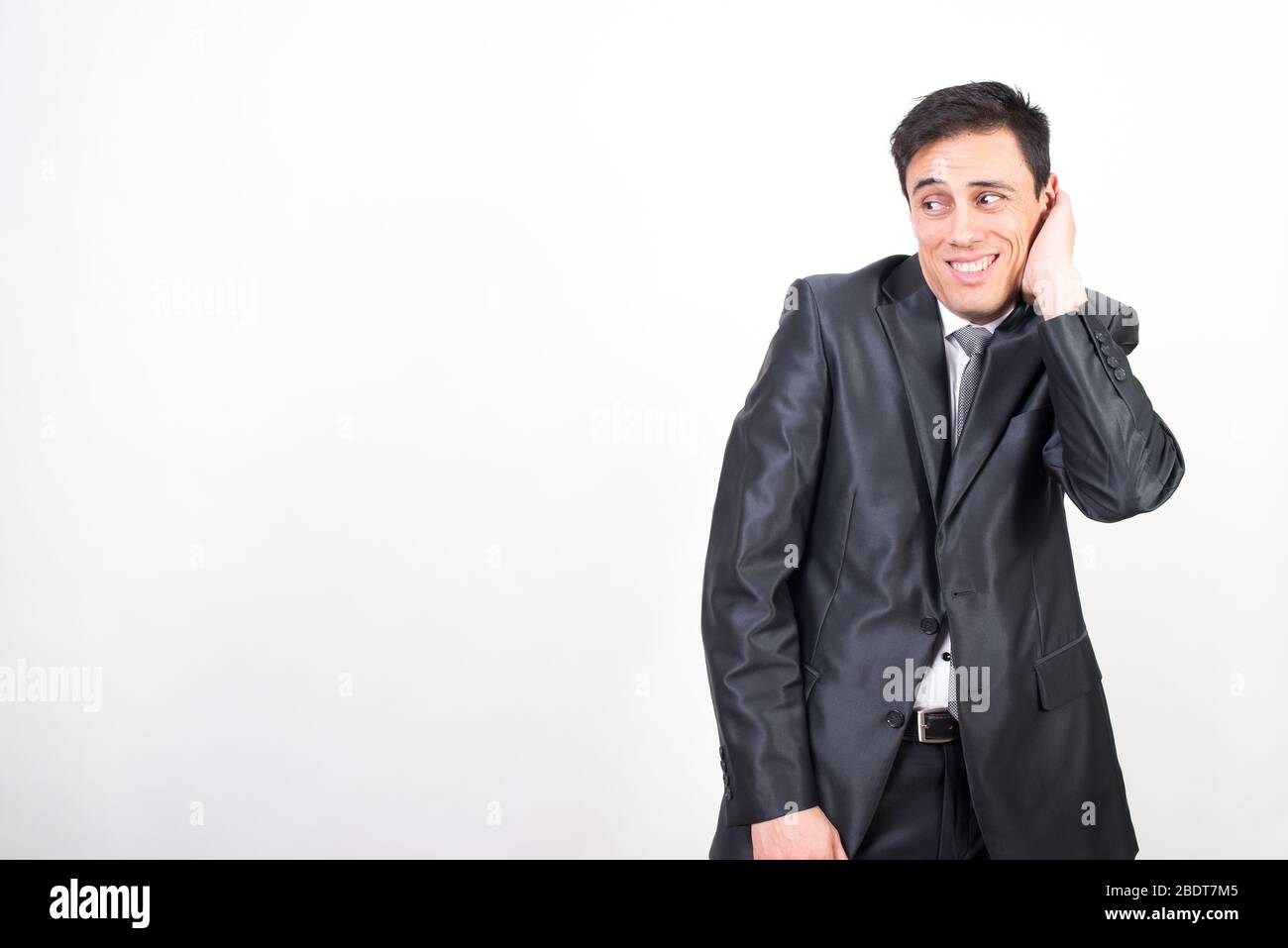 Shy man in suit. White background, Medium shot Stock Photo - Alamy