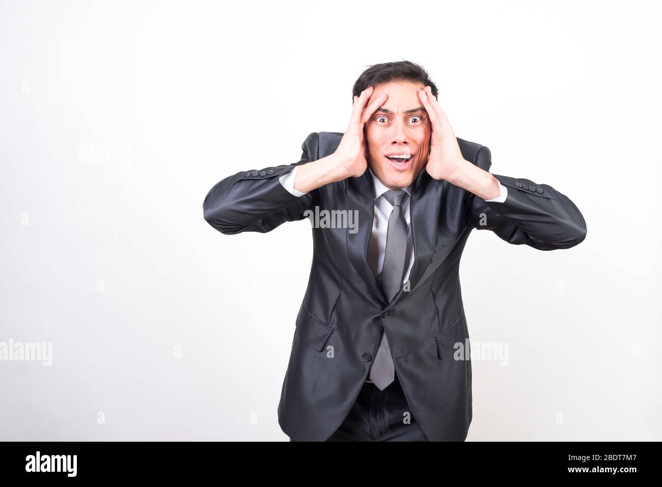 Surprised man in suit. White background, Medium shot Stock Photo - Alamy