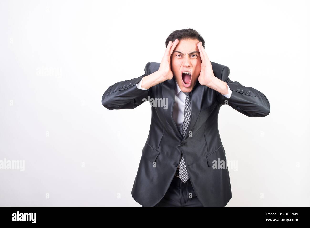 Surprised man in suit. White background, Medium shot Stock Photo - Alamy