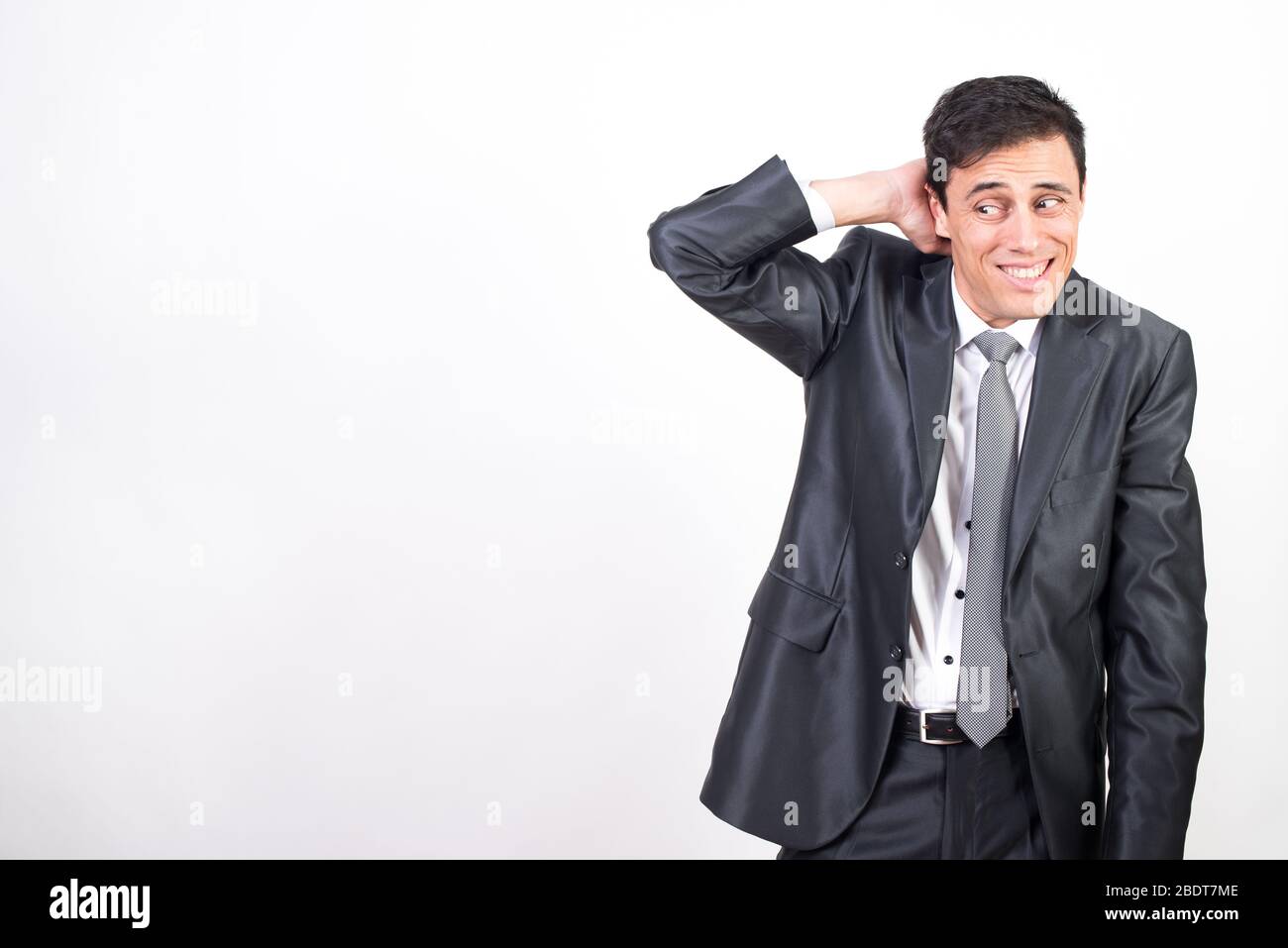 Shy man in suit. White background, Medium shot Stock Photo - Alamy
