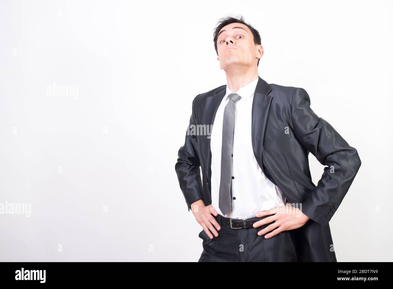Vigilant man in suit. White background, Medium shot Stock Photo - Alamy
