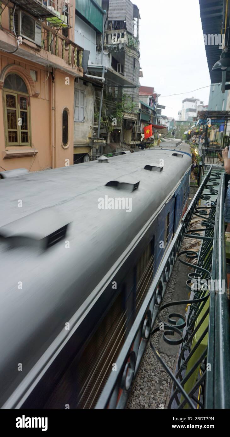 train crossing famous train street in hanoi vietnam Stock Photo - Alamy