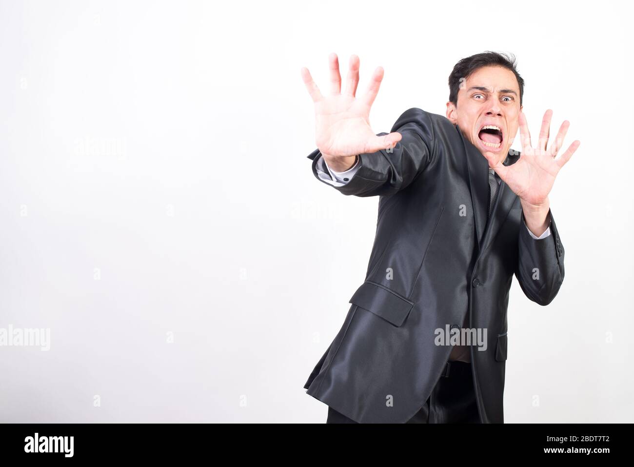 Scared man in suit on white background, medium shot Stock Photo - Alamy