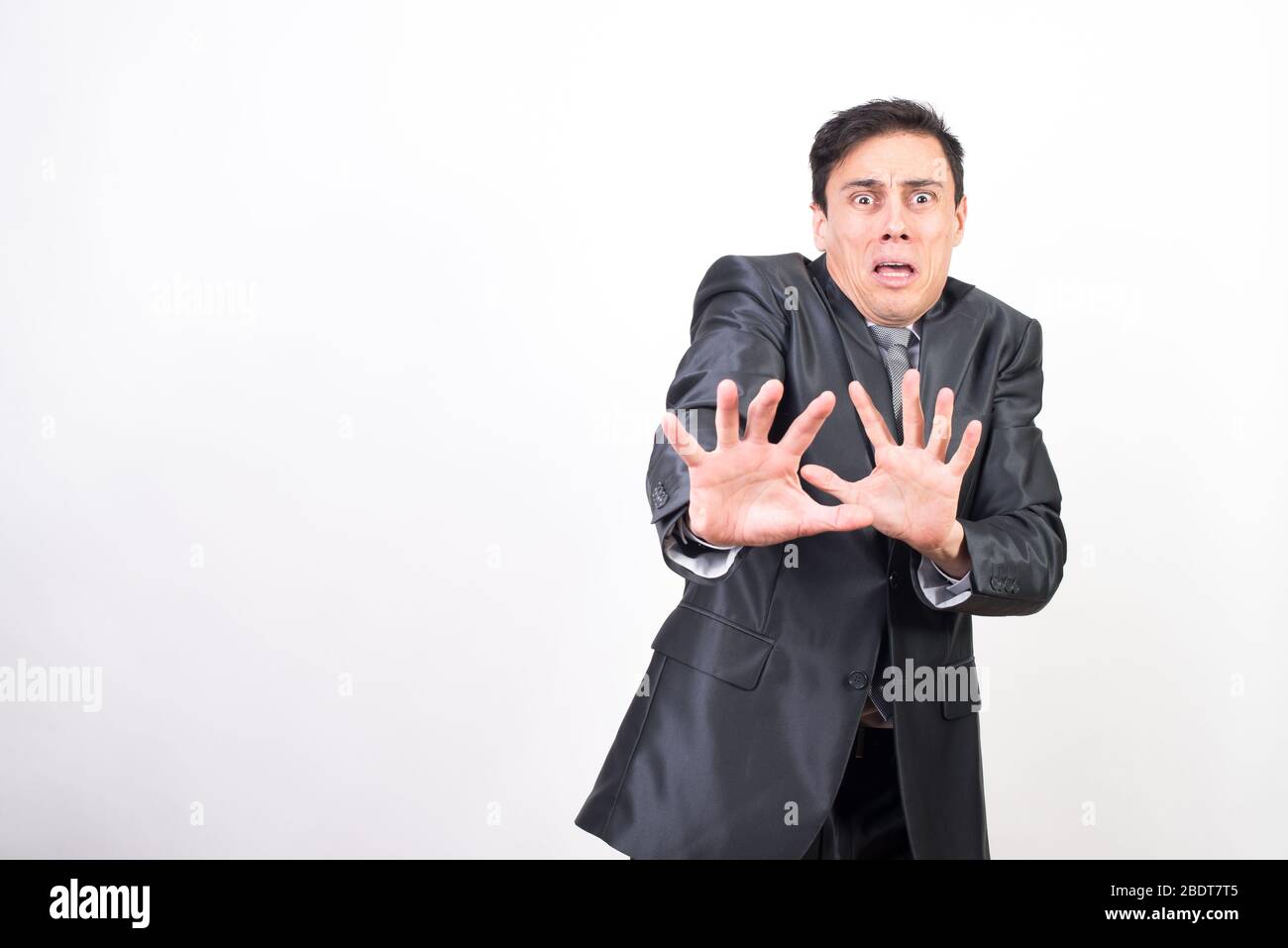 Scared man in suit on white background, medium shot Stock Photo - Alamy