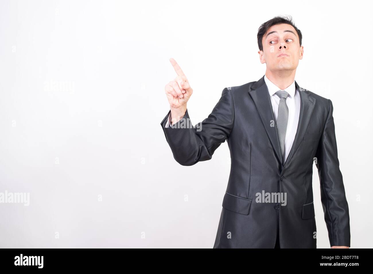 Challenging man in suit. White background. Middle plane Stock Photo - Alamy