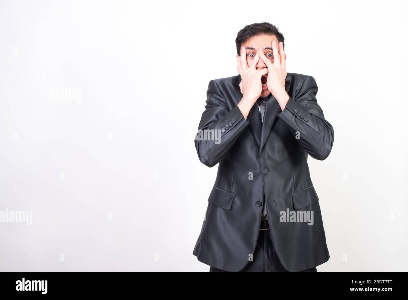 Scared man in suit on white background, medium shot Stock Photo - Alamy