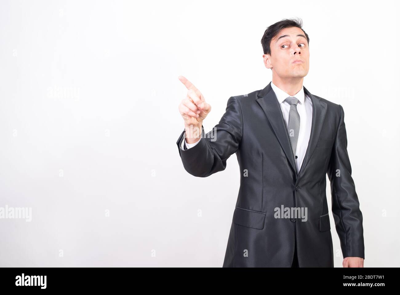 Challenging man in suit. White background. Middle plane Stock Photo - Alamy