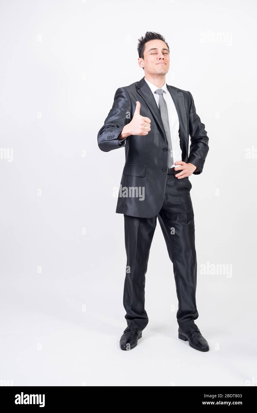 Satisfied man in suit. White background, full body Stock Photo - Alamy