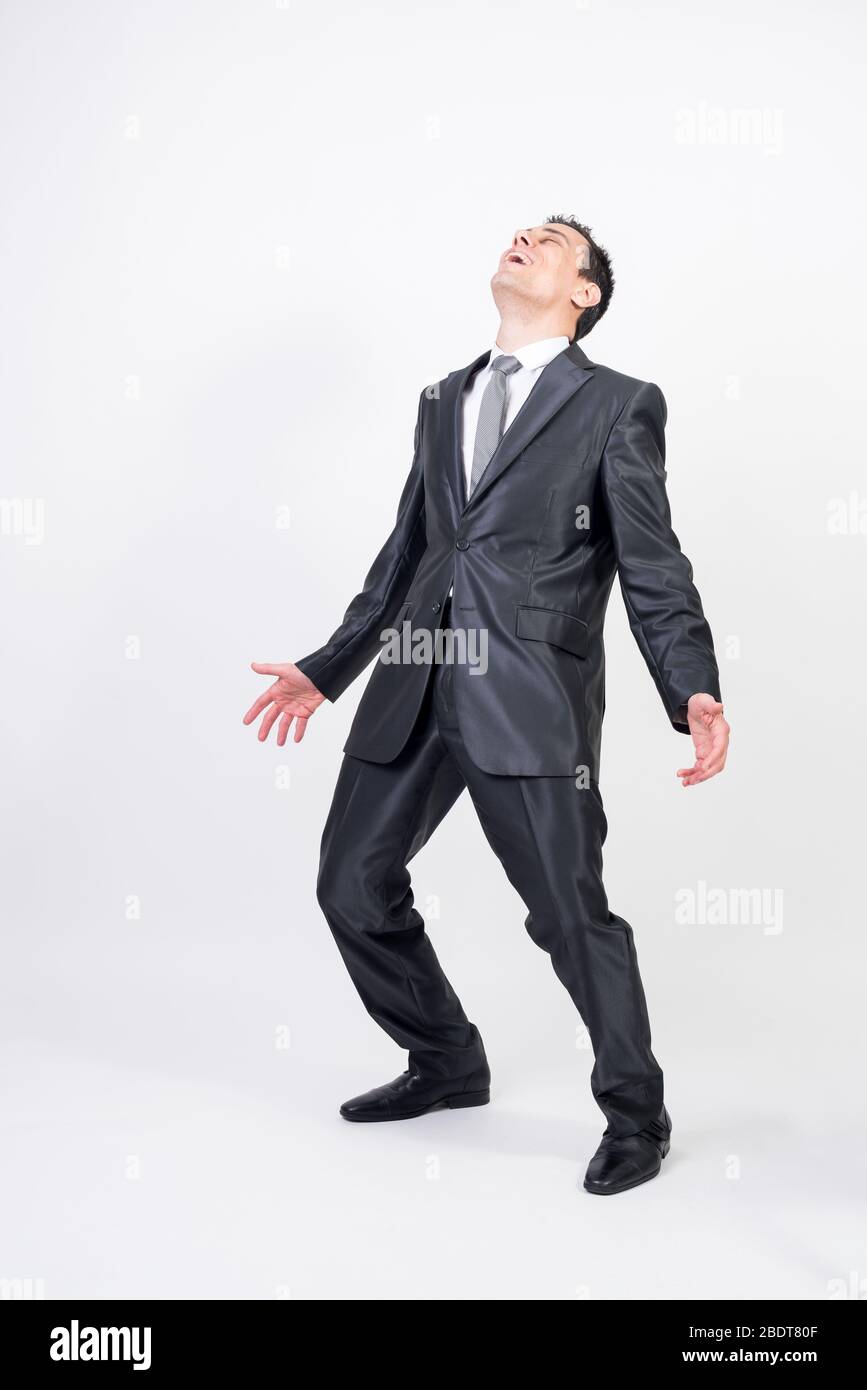 Man in suit feeling pleasure. White background, full body Stock Photo ...