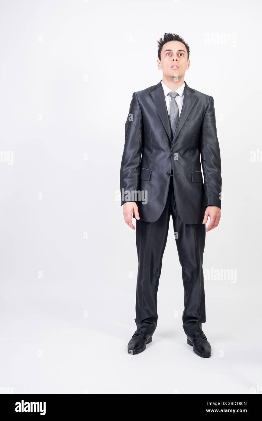Man in suit in trance. White background, full body Stock Photo - Alamy