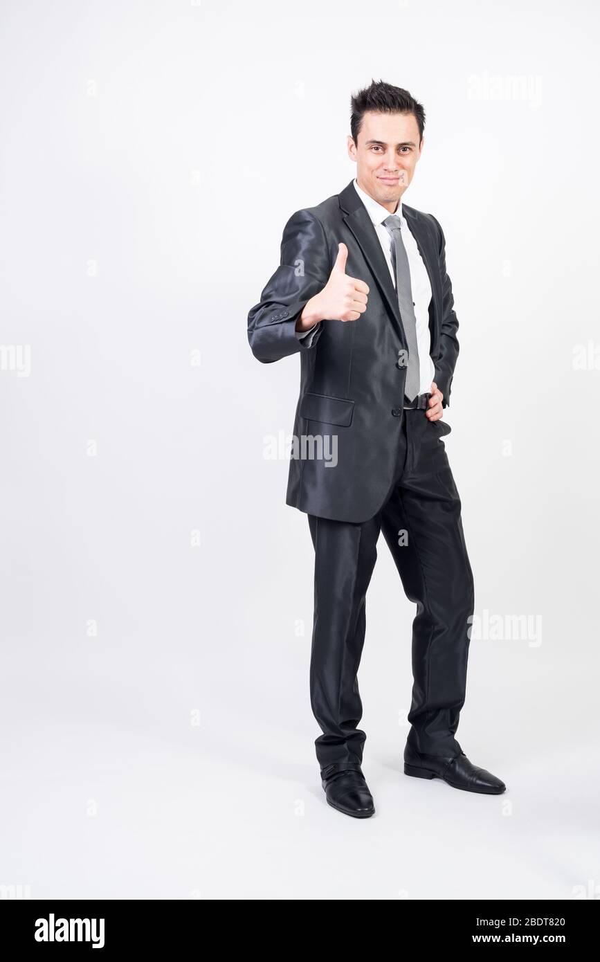 Satisfied man in suit. White background, full body Stock Photo - Alamy