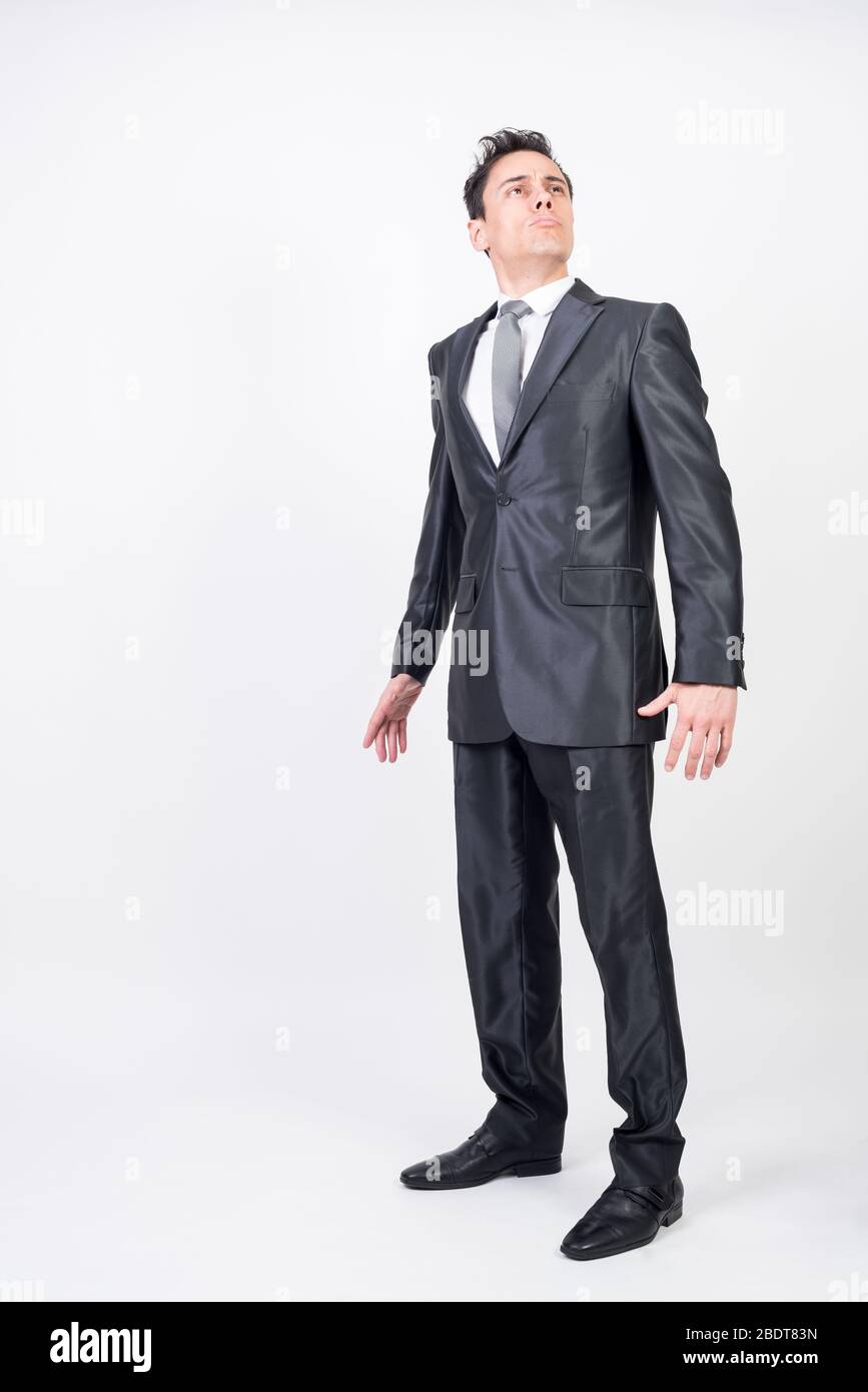 Arrogant man in suit. White background, full body Stock Photo - Alamy