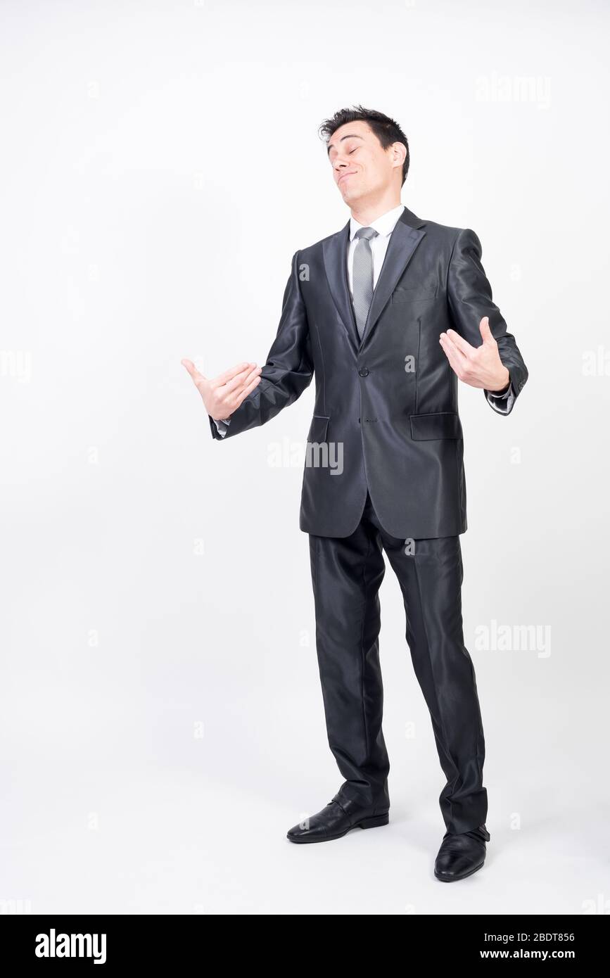 Arrogant man in suit. White background, full body Stock Photo - Alamy