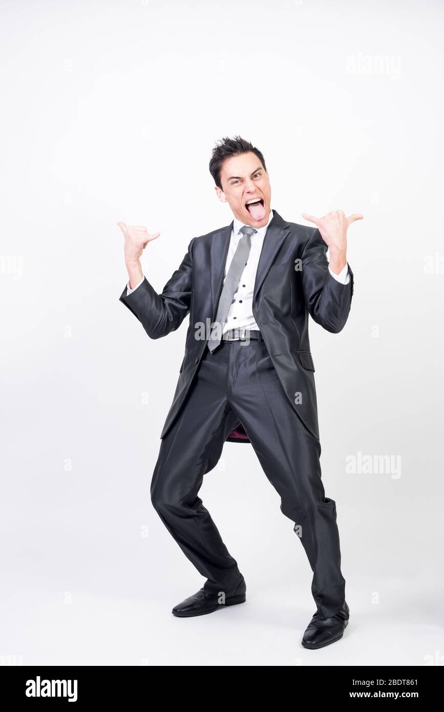 Rocker man in suit. White background, full body Stock Photo - Alamy