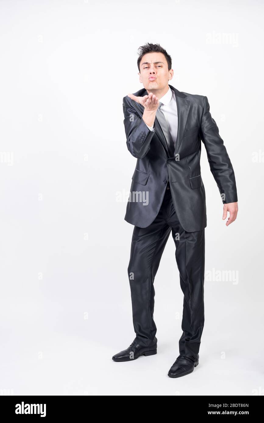 Seductive man in suit. White background, full body Stock Photo - Alamy