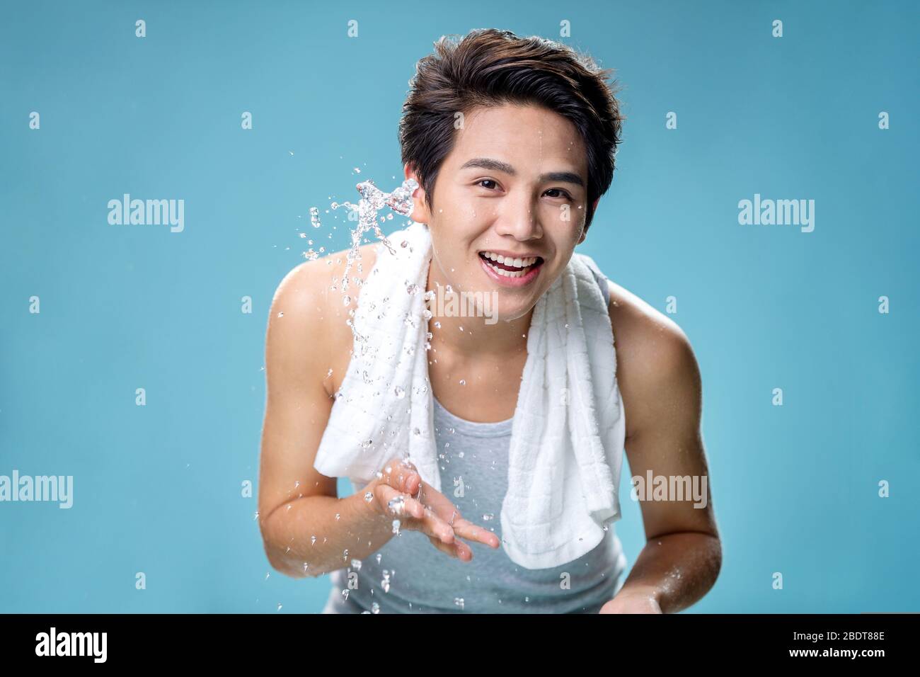 Indian man washing at the well hi-res stock photography and images - Alamy