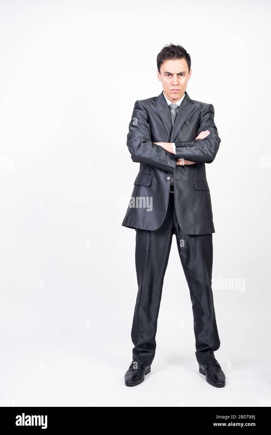 Serious man in suit. White background, full body Stock Photo - Alamy