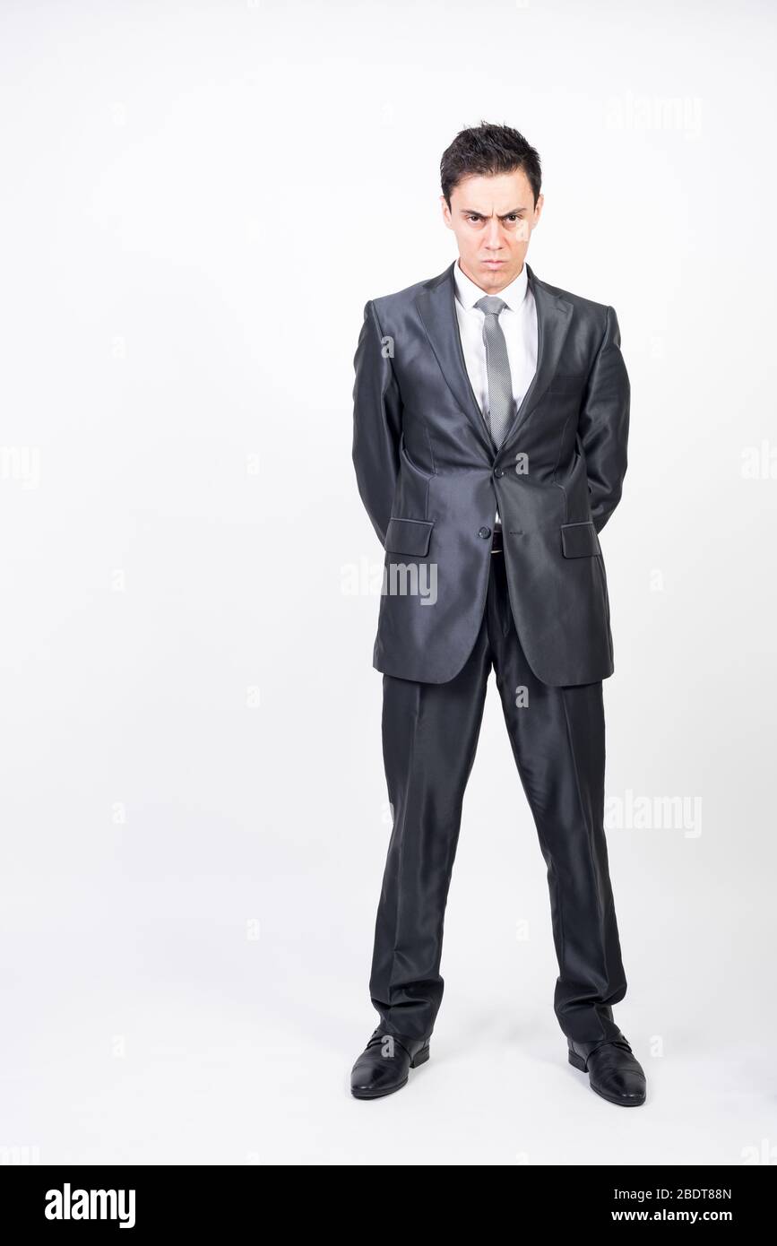 Serious man in suit. White background, full body Stock Photo - Alamy