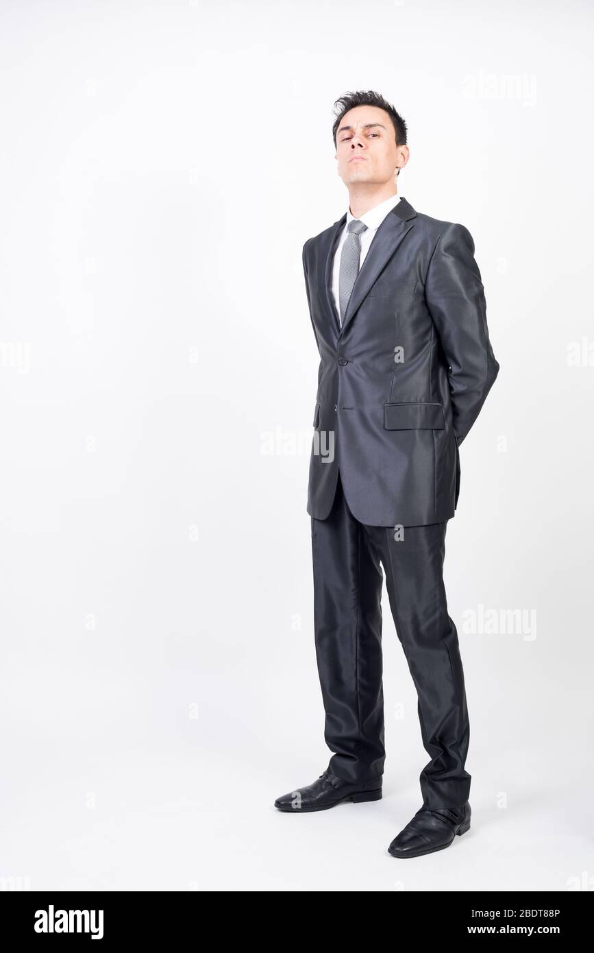 Serious man in suit. White background, full body Stock Photo - Alamy