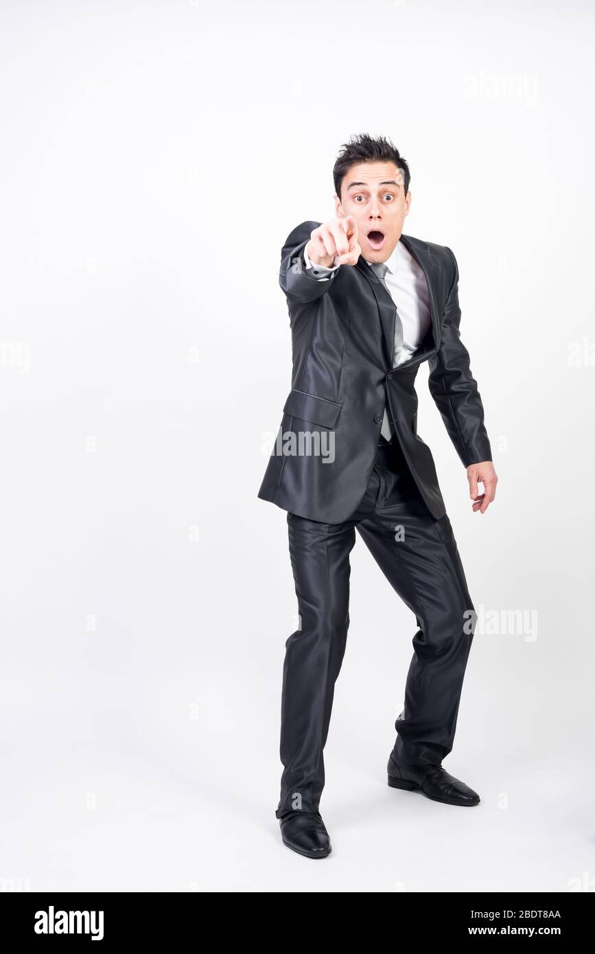 Man in suit pointing in front with index finger. White background, full ...