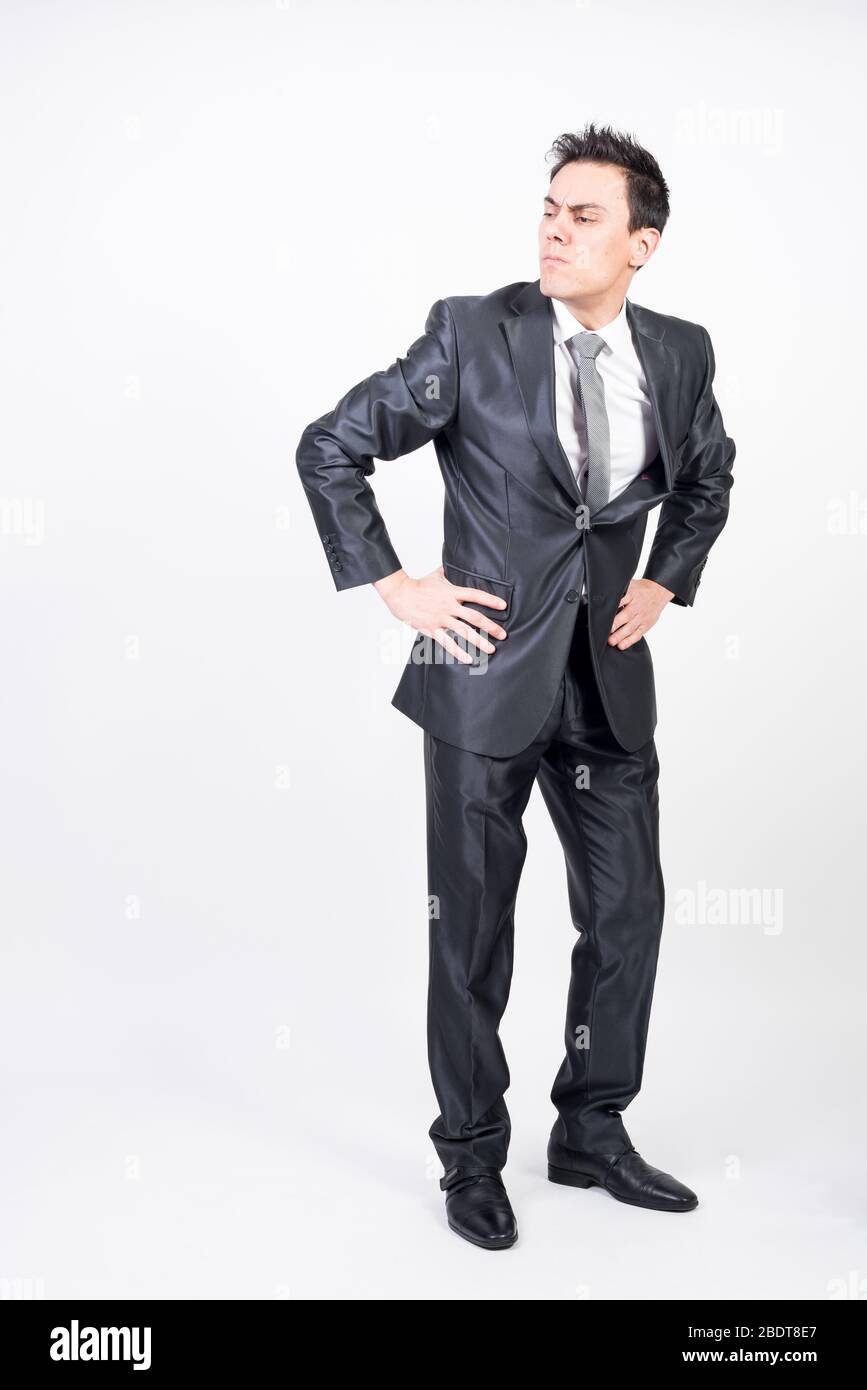 Vigilant man in suit. White background, full body Stock Photo - Alamy