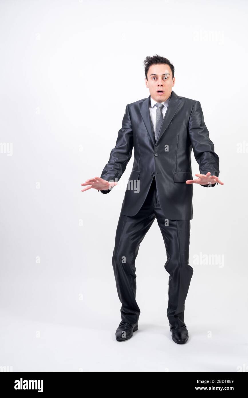 Scared man in suit on white background, full body Stock Photo - Alamy