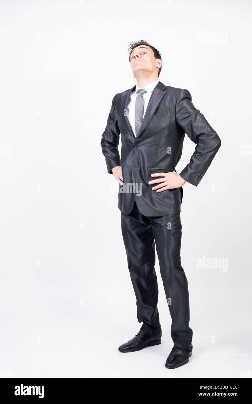 Vigilant man in suit. White background, full body Stock Photo - Alamy