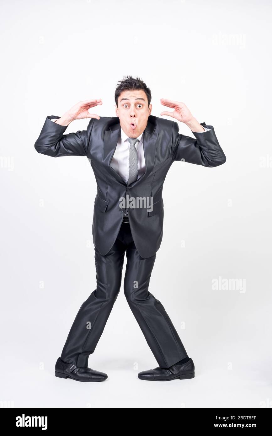 Silly man in suit. White background, full body Stock Photo - Alamy