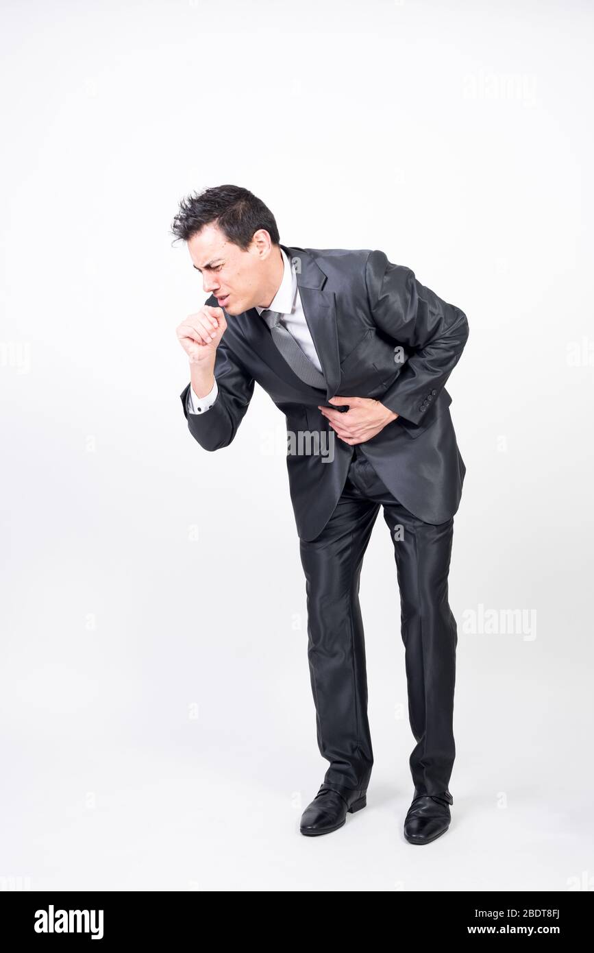 Man in suit coughing. White background. full body Stock Photo - Alamy