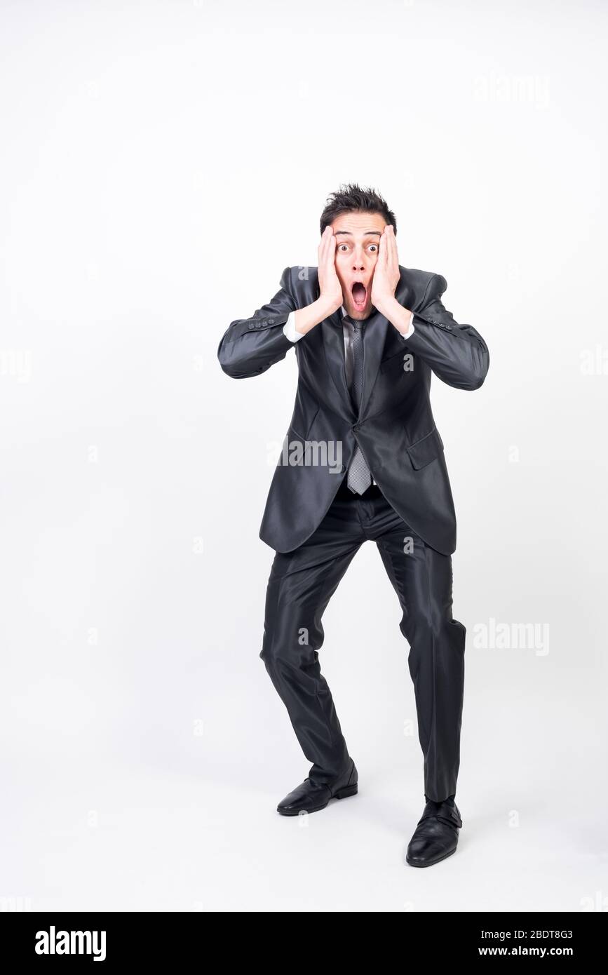 Surprised man in suit. White background, full body Stock Photo - Alamy
