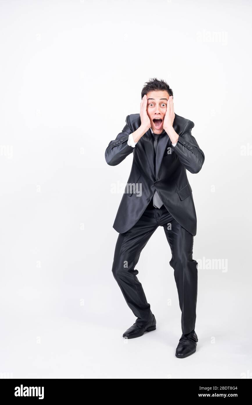 Surprised man in suit. White background, full body Stock Photo - Alamy